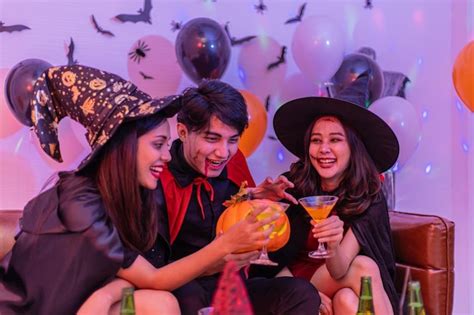 Premium Photo Asian Young People In Costumes Celebrating Halloween