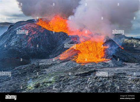 Heavy Smoke Over An Active Volcanic Crater Lava Flow From An Active