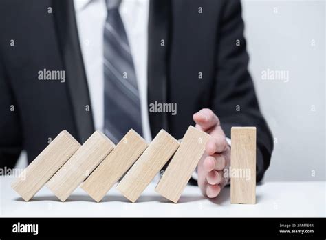 wooden domino business strategy risk managment solving balance
