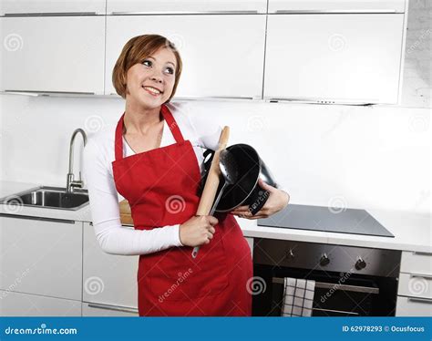 Sweet Cook Woman Wearing Red Apron Holding Cooking Pot And Rolling Pin