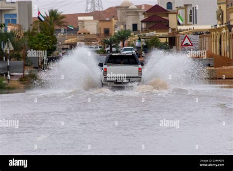 Truck Driving Through Flood Waters On The Street Making Large Splashes