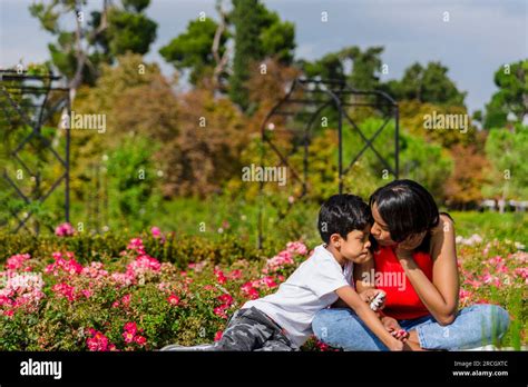 Mother And Son Having Fun Together While Enjoying A Day In The Park