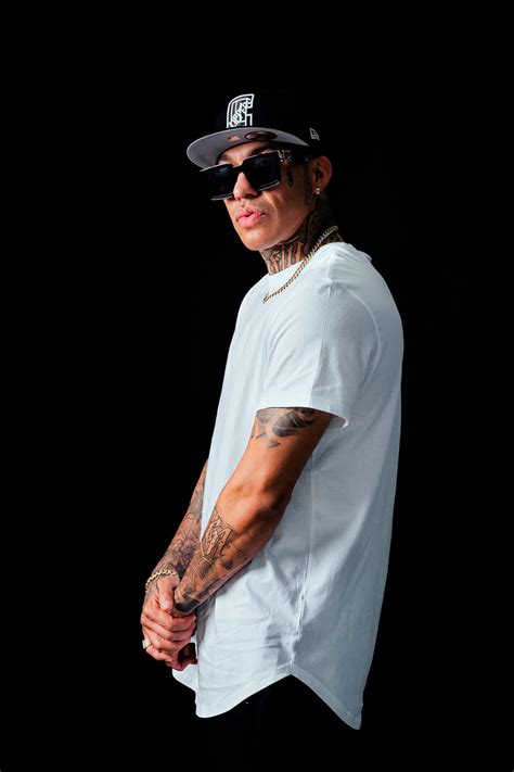 Download Stylish Manwith Tattoosand Sunglasses Wallpaper