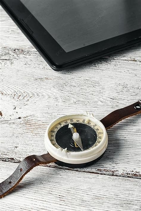 Old Compass And Tablet Pc On Bright Wooden Background Compass And