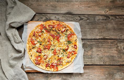 Baked Round Pizza With Smoked Sausages Mushrooms Tomatoes Cheese And