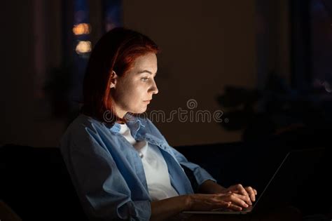 Concentrated Middle Aged Programmer Female Sits On Chair Work On Laptop