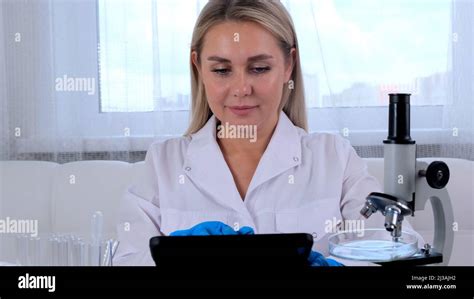Professional Scientist Research Chemist With A Tablet Computer And A