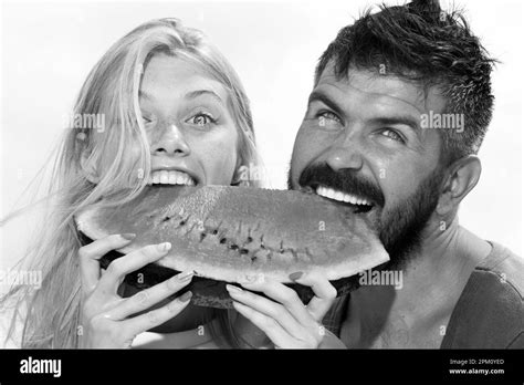 Funny Couple Laughing With A White Perfect Smile And Looking Each Other