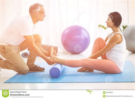Physiotherapist Giving Physiotherapy To Pregnant Lady Stock Image