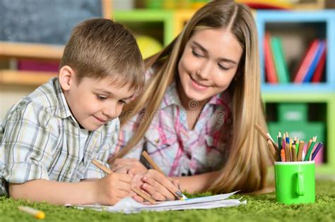 Portrait Of Mother And Son Drawing With Pencils Stock Image Image Of