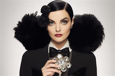 Premium Photo A Woman In A Tuxedo Holds A Silver Ball