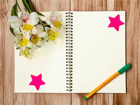 Premium Photo Top View Of Open Notebook Marker And Alstroemeria