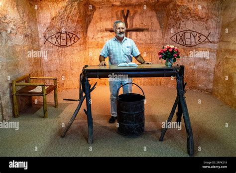 An Anglican Priest At The Altar Made From A Mining Windlass In An