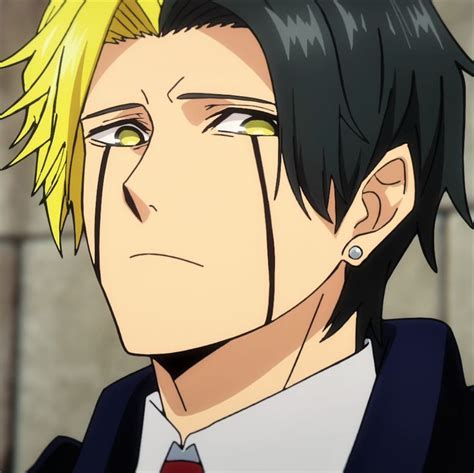 An Anime Character With Yellow Hair And Piercings On His Ears Looking