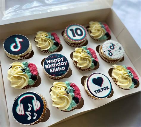 A Box Filled With Lots Of Cupcakes Covered In Frosting