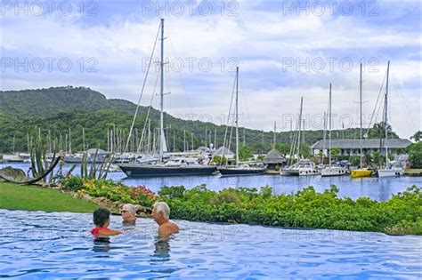 Sailing Boats And Yachts Moored In English Harbour And Western Tourists
