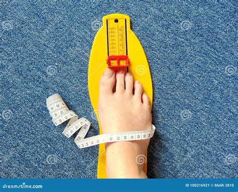 Yellow Foot Measurement Device With Naked Foot Upon With Measuring Tape Stock Image Image Of