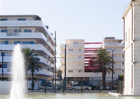 Pink Walls Frame Rooftop Garden Of Housing By Pietri Architectes