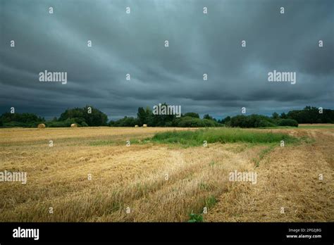 Dark Storm Clouds Over Stubble Field Summer Day Eastern Poland Stock