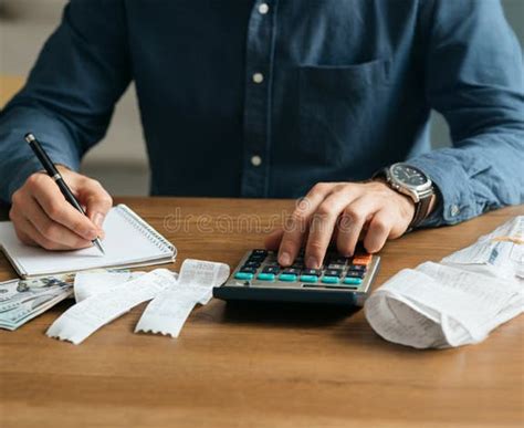 Man Calculating With Shopping Receipt Banknotes And Calculator On A Table Stock Illustration