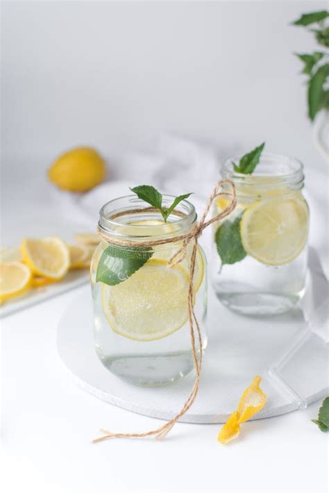 Lemon Lime Soda In A Mason Jar With A Lemon And Basil Leaves Stock