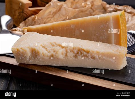 Aged Italian Parmesan Hard Cheese Parmigiano Reggiano With Cheese Knife