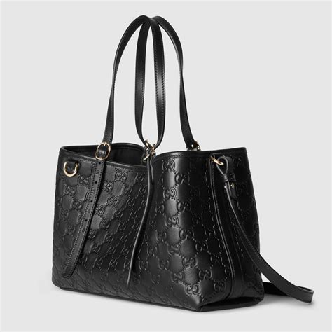 Gg Emblem Medium Tote Bag In Black Leather Gucci® Dk