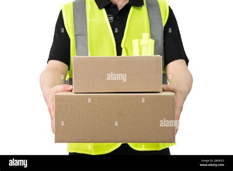 Delivery Man Holding A Big Parcel Isolated On White Background Stock