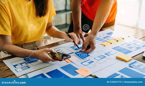 Ux Developer And Ui Designer Brainstorming About Mobile App Interface