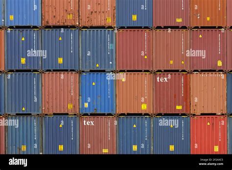 Stack Of Cargo Shipping Containers In Port Colourful Wall Of Freight