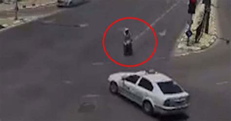 Motorcyclist Thrown 20ft Into The Air In Horrific Accident After Taxi