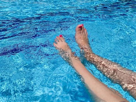 Premium Photo Beautiful Woman Legs Splashing In The Pool