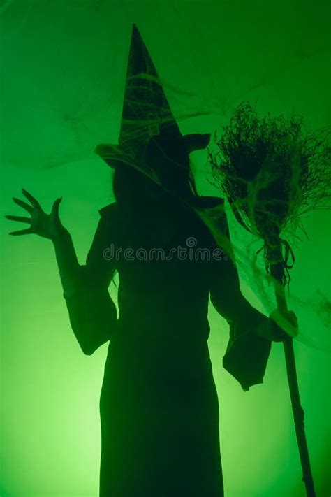 Witch Silhouette With Broom On Green Background Stock Image Image Of