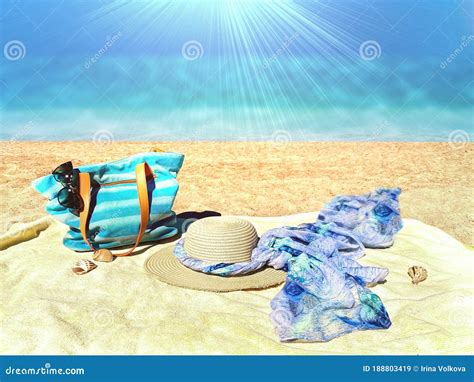 Summer Beach Women Hat And Blue Bag And Sunglasses On Blanket At Beach