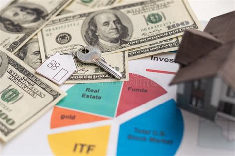 Keys And Stack Of Dollars Isolated On A White Background Stock Photo