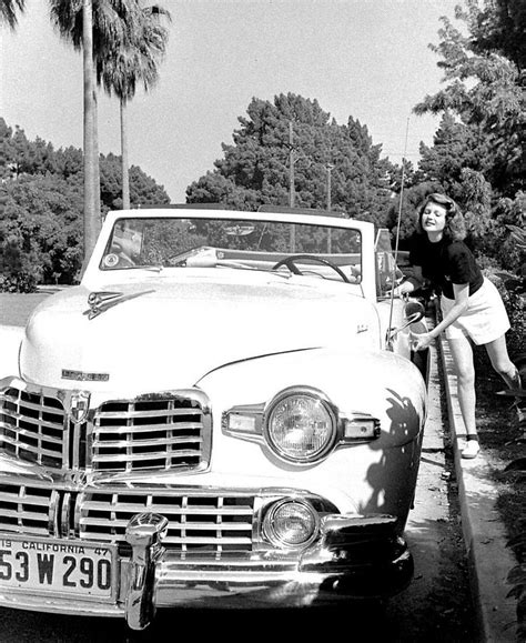 Rita Hayworth Climbs Into Her Convertible Outside Her Home October