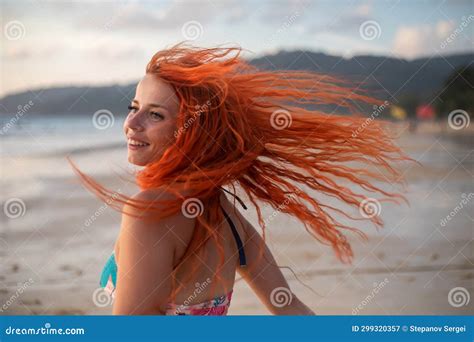 Beautiful Girl With Red Hair Posing On The Beach Sunset Stock Image