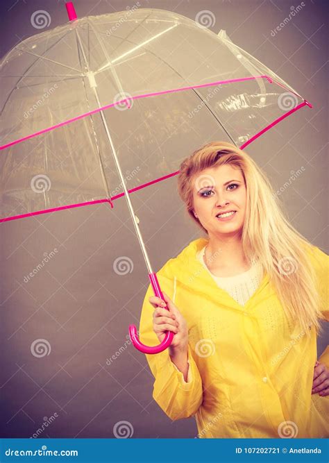 Happy Woman Wearing Raincoat Holding Transparent Umbrella Stock Image