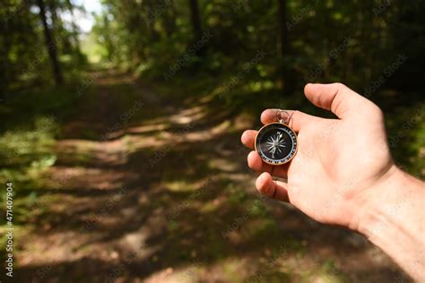 Compass In Hand At Forest Tourist Compass For Orientation On The