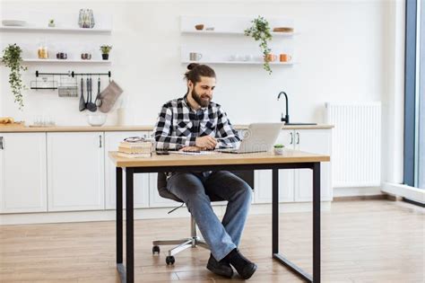 Positive Entrepreneur Discussing Company Issues Using Computer In