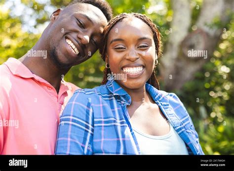 African American Couple Smiling Outdoors Enjoying Sunshine Together At