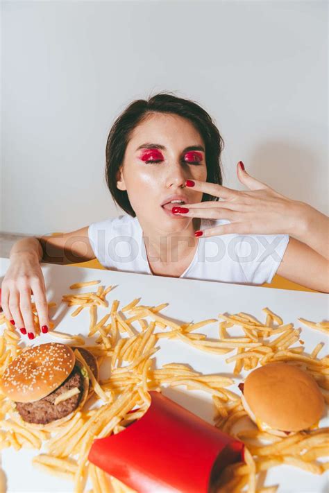 Sensual Babe Woman Licking Her Finger After Eating Fast Food Stock Image Colourbox