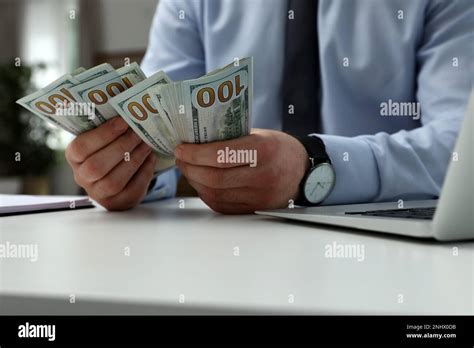 Cashier Counting Money At Desk In Bank Closeup Stock Photo Alamy