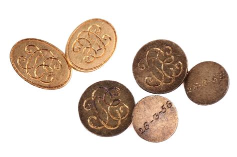 Lot 92 A Pair Of Round Monogrammed Cufflinks With