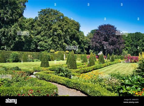 Formal French Garden With Topiary Flower Beds Hedges Lawns And Tall