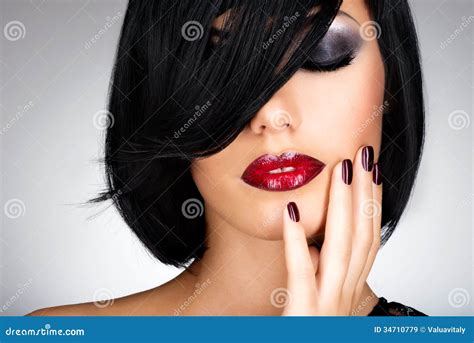 Face Of A Woman With Beautiful Dark Nails And Red Lips Stock Image