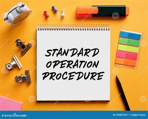 the word standard operation procedure sop written on a notebook on