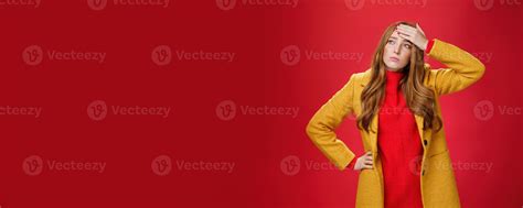 Girl Having Feaver Touching Forehead With Palm Looking Displeased And Bothered Left As Thinking