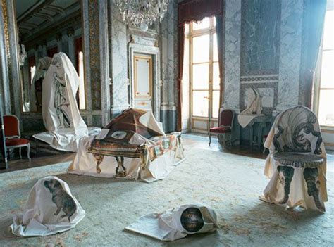 Several Pieces Of Art On Display In An Ornate Room