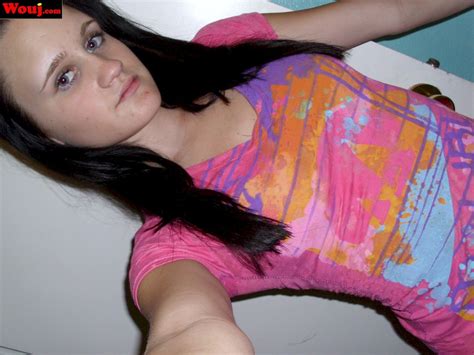 Cutie With Brunette Hair Takes Pictures Of Her Squeezing Her Nice Tits Photos